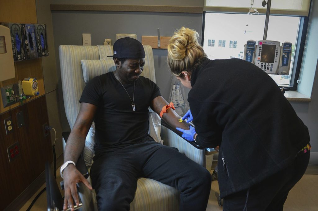 Frzy winces as Jen Matthews, a registered nurse at UPMC Magee-Womens ...